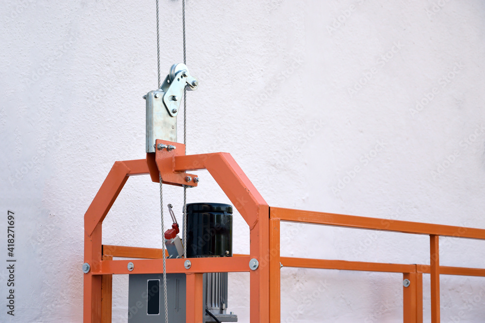 Hoist supply and safety lock as part of suspended wire rope platform ...