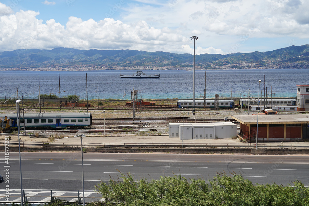 Railway station and ferry on Strait of Messina, narrow strait between ...