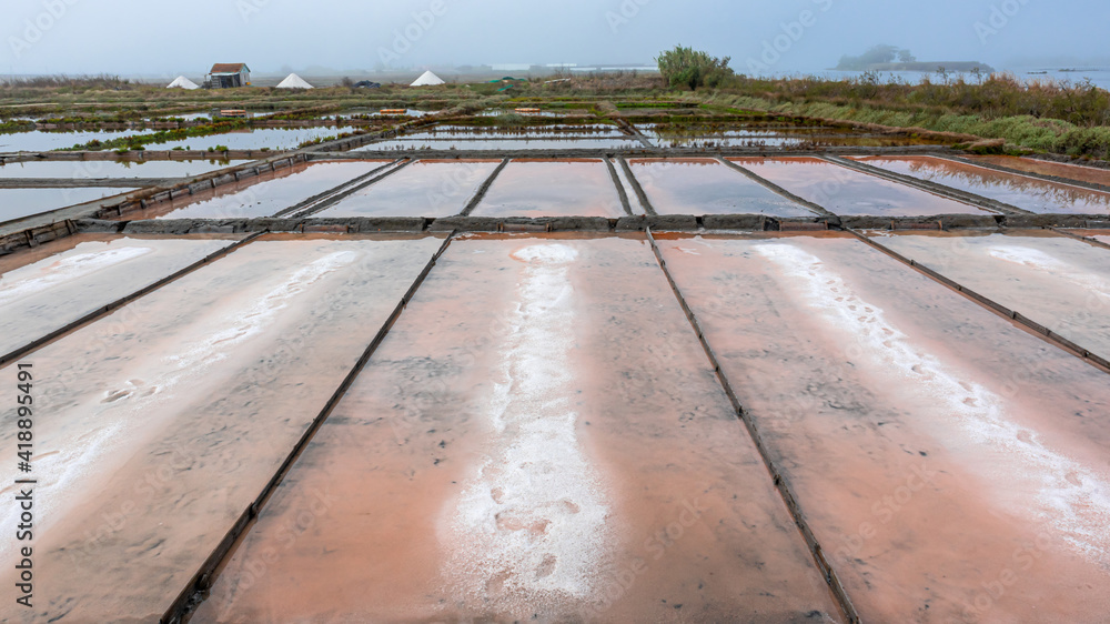 Different types of salt in salt pans with salt harvesting pools Stock ...