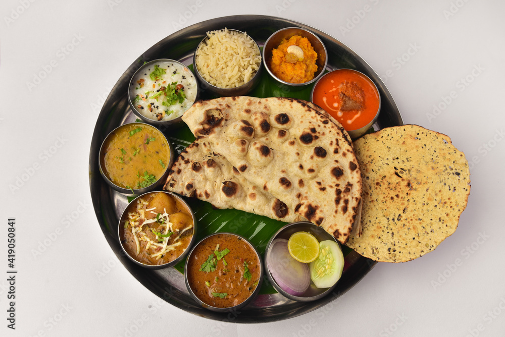 north Indian thali top view. roti, pappad rice and variety of curries ...