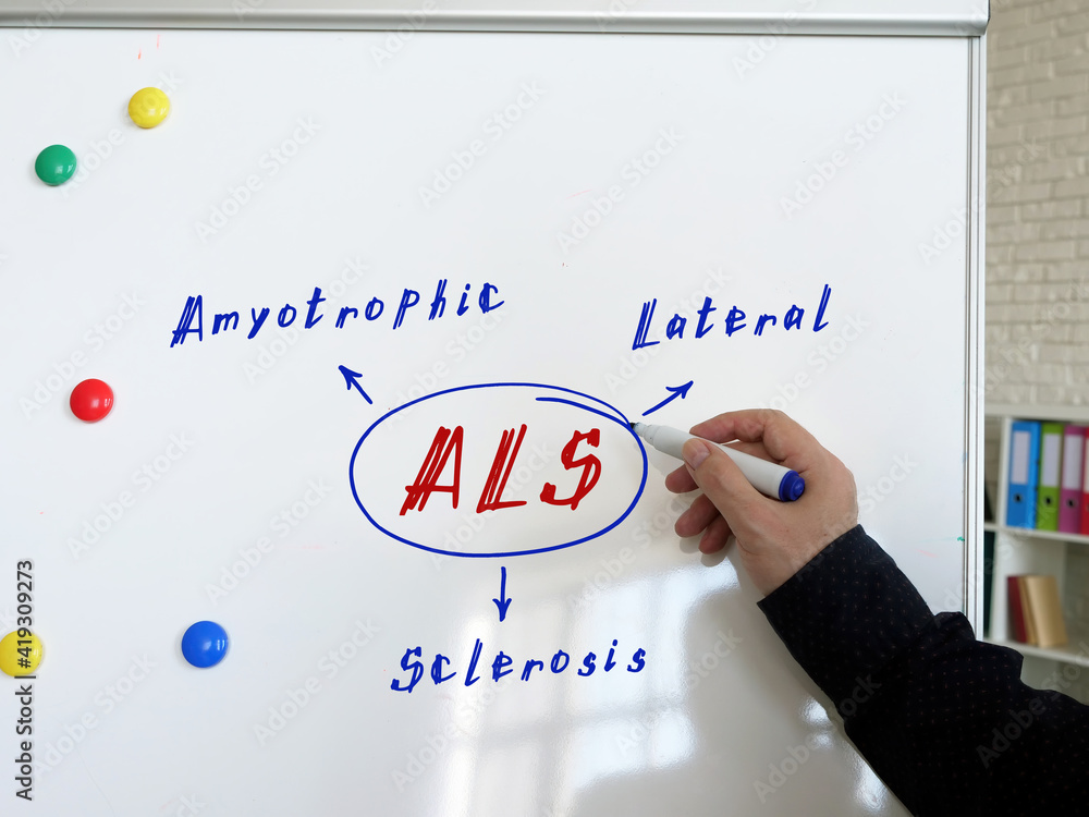 ALS Amyotrophic Lateral Sclerosis note. Male hand with marker write on ...