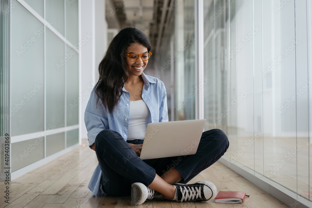 African American woman freelancer using laptop computer, typing ...