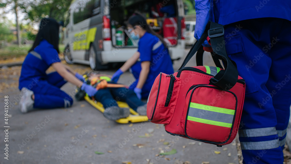 Selective focus is first aid bag. Team paramedic firs aid accident on ...