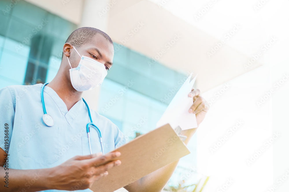 young doctor or nurse reviewing a check-up chart or an examination of a ...
