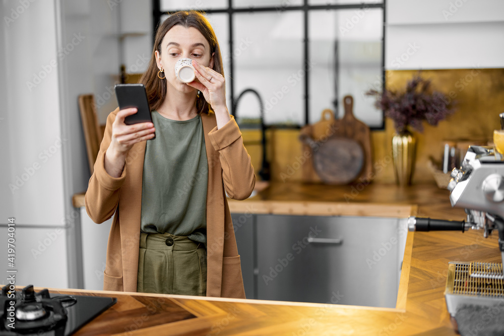 Fussy young woman in a hurry to work in the morning, wearing jacket ...