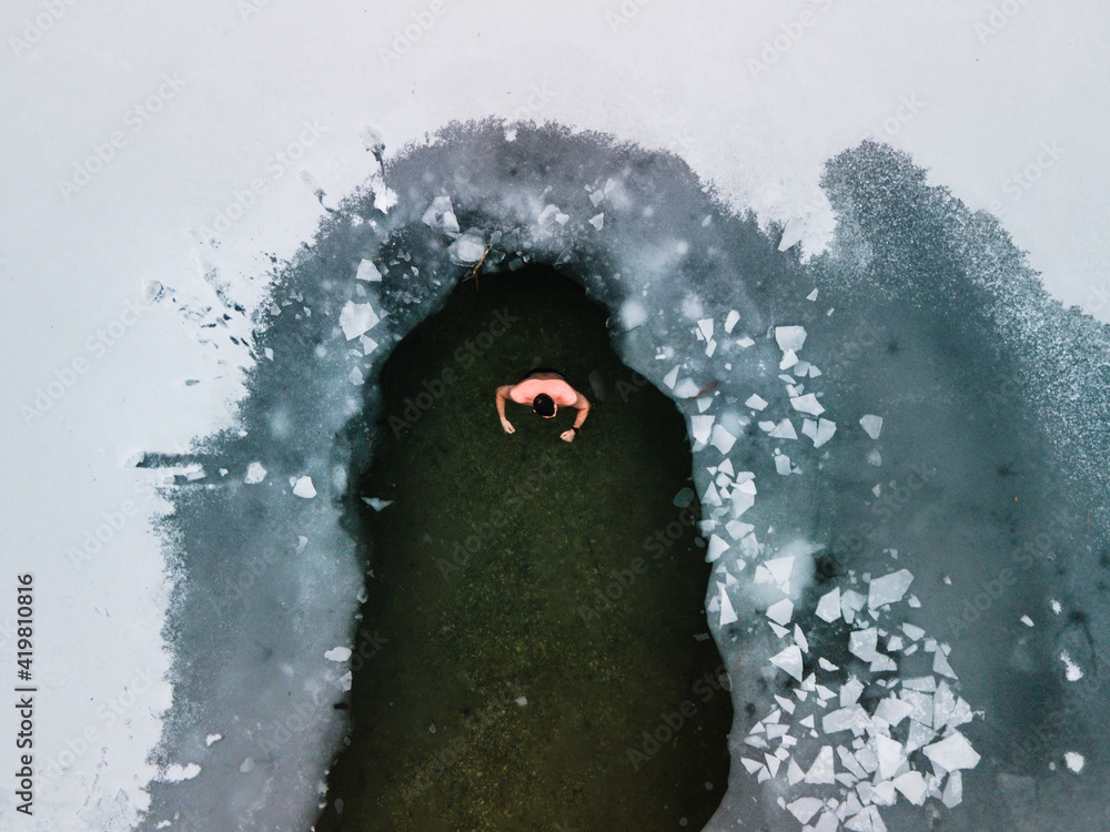 Photo Stock Top view of unidentifiable man in an ice-hole in cold ...