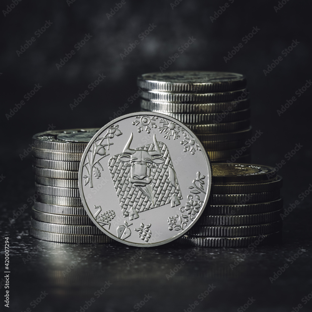 Commemorative coin dedicated to the symbol of 2021 on the background of ...