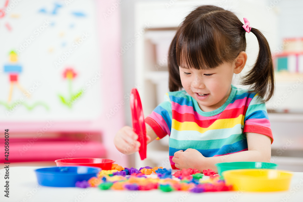 young girl play math and color sorting fine motor skill game for ...