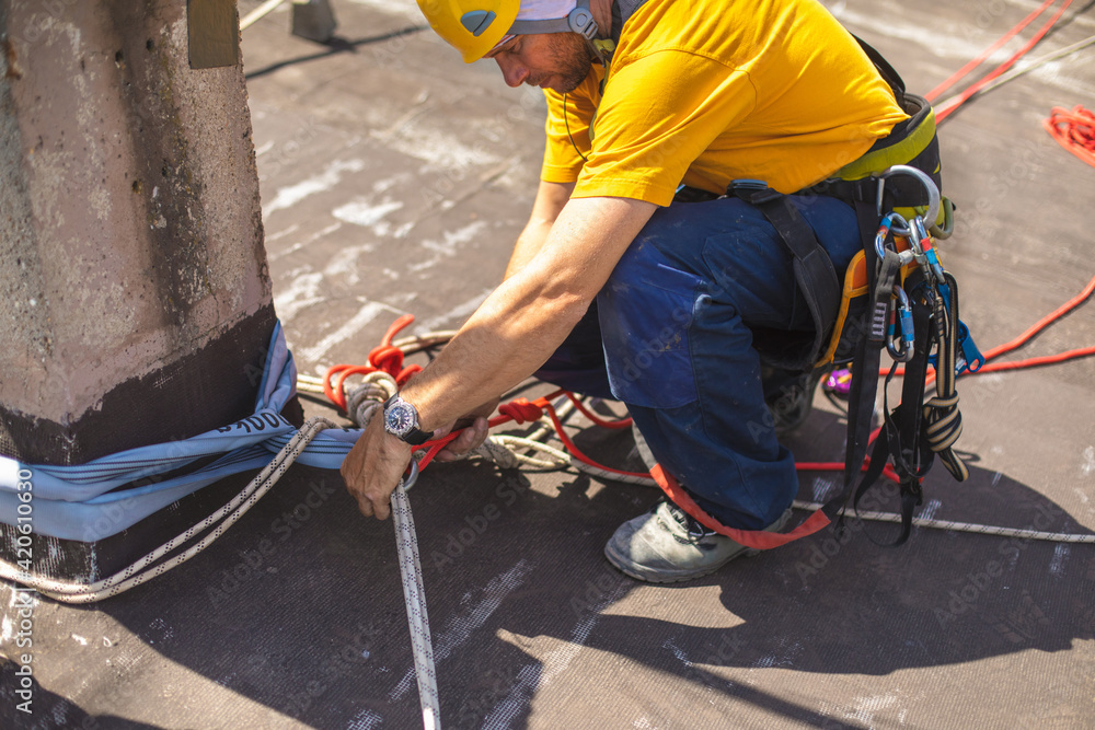 Working at elevations. Rope access, high-altitude outdoor work. Stock ...