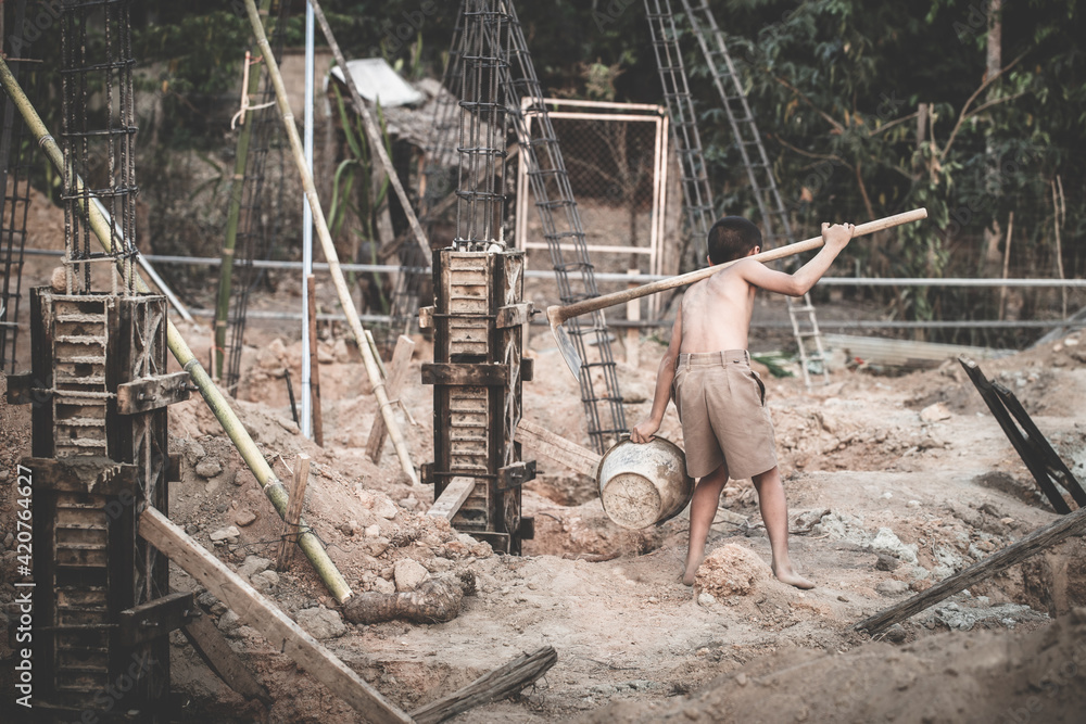 boys labor work in the construction site, Against child labor, Poor ...