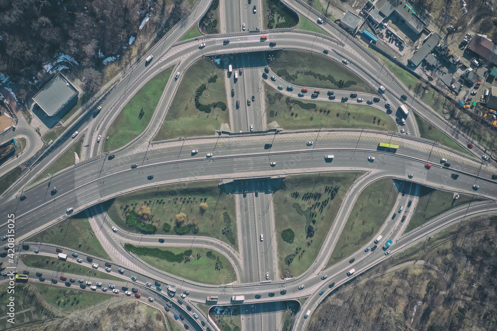 Aerial high drone in flight over evening road traffic. Highway and ...