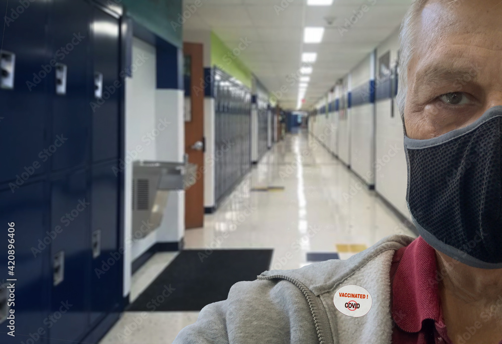 Vaccinated Masked Teacher in Empty School Hallway Waiting for Students ...