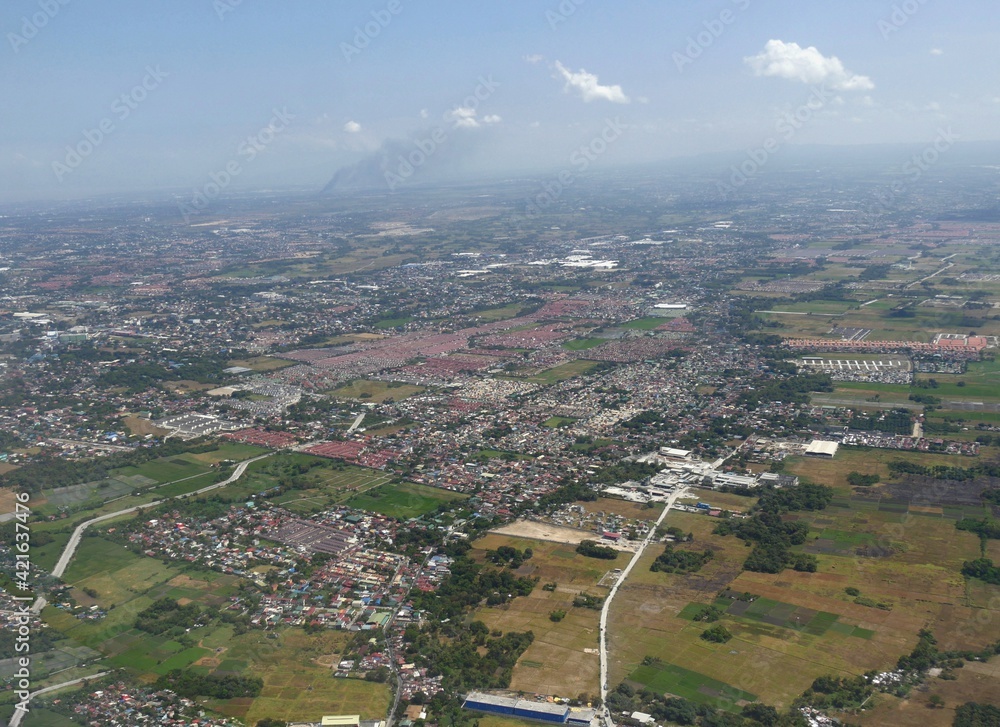 Aerial view of Manila, Philippines, seen from the window of an airplane ...