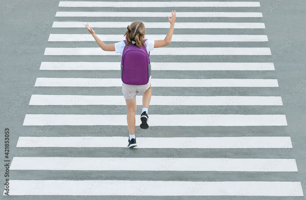 Stylish young teen girl walking with backpack. Active child. Kid runs ...