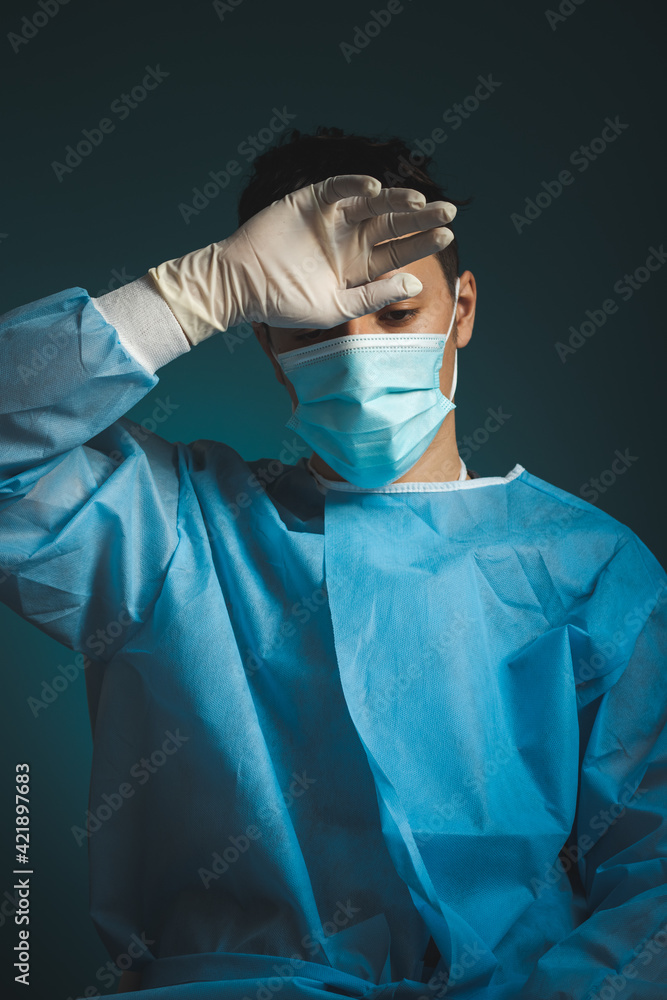 Tired doctor after hard working hours on intensive care with covid ...