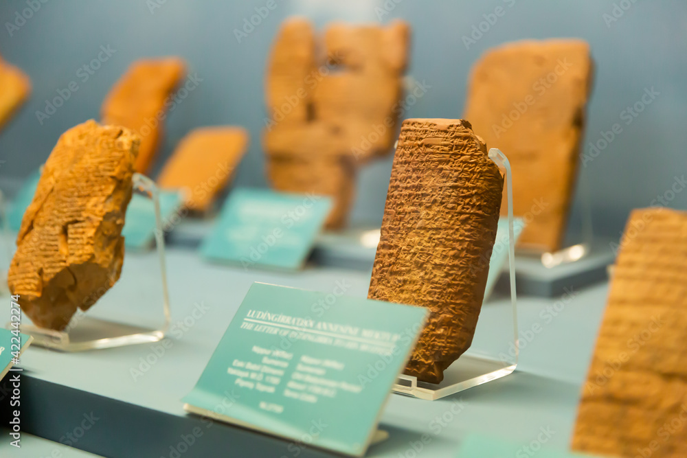 ISTANBUL, TURKEY - JANUARY 1, 2021: Clay tablets with cuneiform writing ...