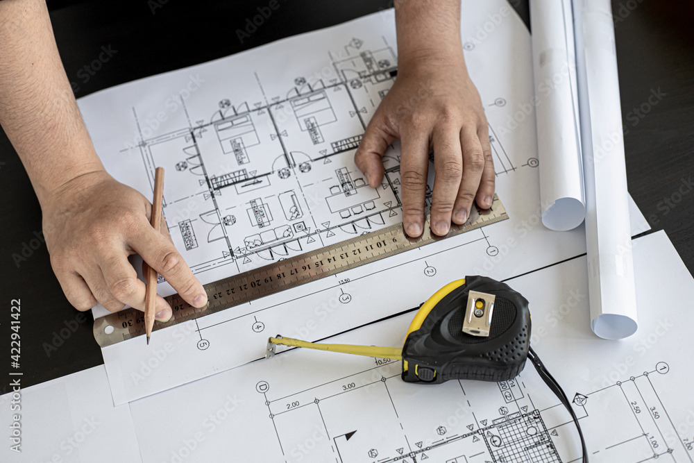 Home design architects are editing the drafts of the house plans, a ...