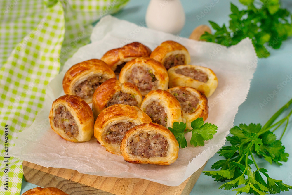 Puff pastry mini sausage rolls with ground beef Stock Photo | Adobe Stock