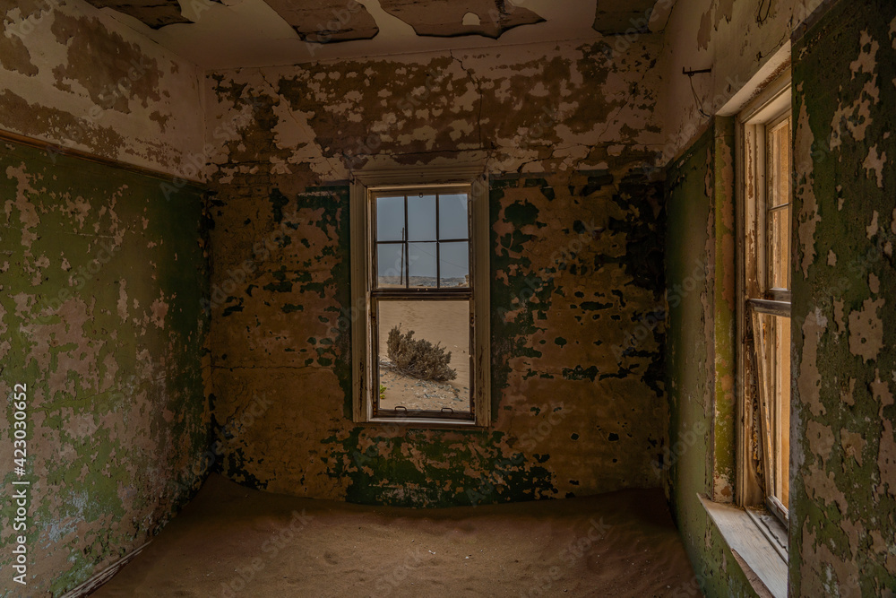 German Kolmanskop Ghost Town with the abandoned buildings in the Namib ...