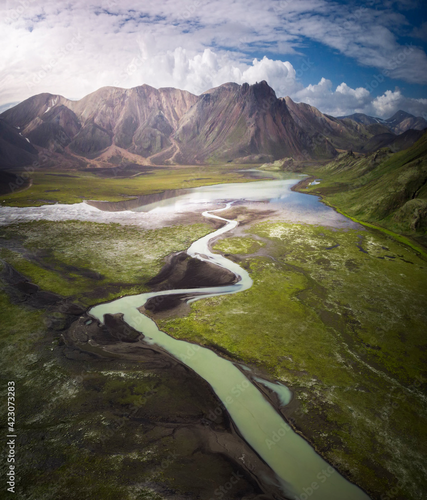 Amazing view of curvy blue river loop streaming on rough hilly terrain ...
