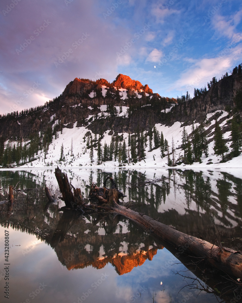 Early summer sunset on White Pine Lake as Mount Magog reflects in the ...