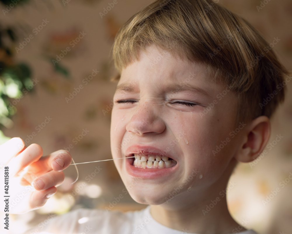 Foto de Stock little kid with tears on his face close-up. boy tries to ...
