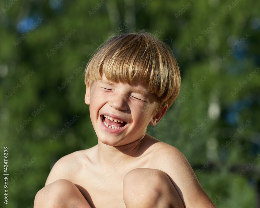 Portrait of naked little boy squatting on haunches with eyes closed and ...