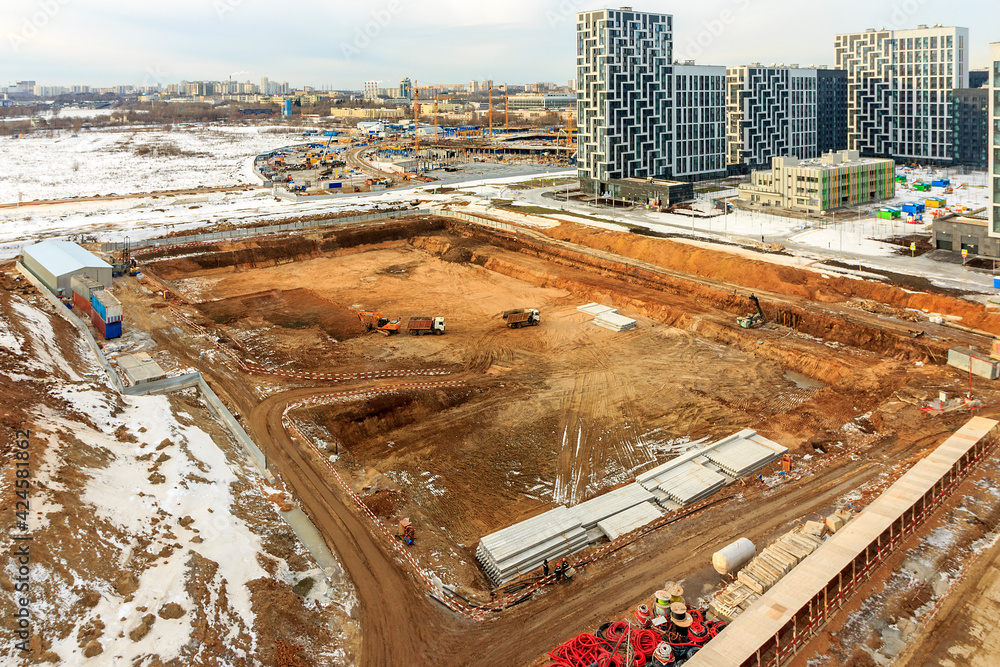 Reinforced concrete piles of new building, tower crane. Hydraulic ...