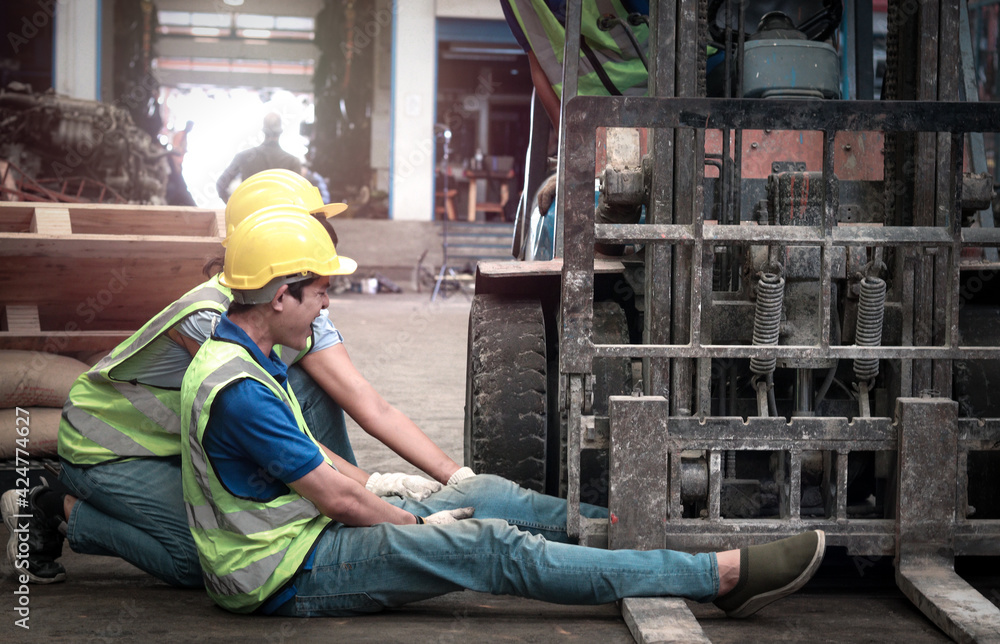 Accident at workplace, industrial engineer worker wearing helmet hit by ...
