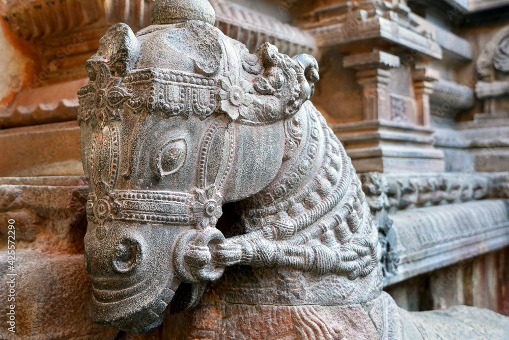 Horse sculpture carved in the stone walls of ancient Brihadeeswarar ...