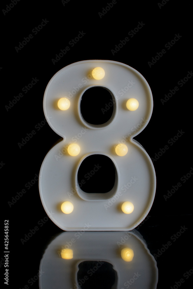 Number 8 (eight) of white plastic, with bright round lights, with a ...