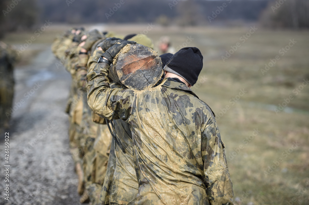 Special forces military training carrying a big log. Photograph detail ...