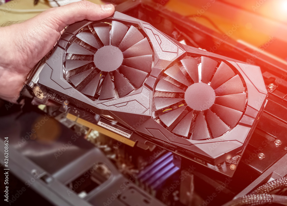Installing video card in an open case of personal computer. Graphics ...