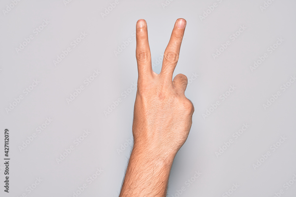 Hand of caucasian young man showing fingers over isolated white ...