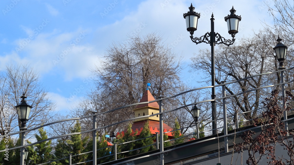 The rails of the funicular are hidden behind the fence, which ...