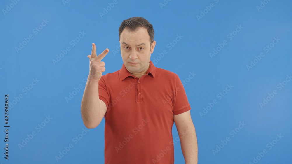 Young man counting numbers with his fingers. He's making a count with ...