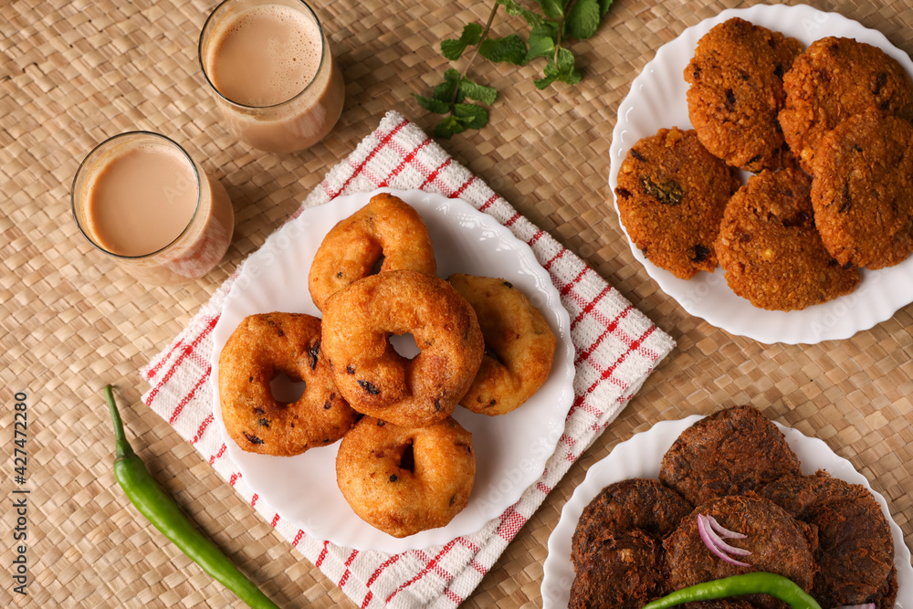 Medu Vada with tiffin sambar coconut chutney in traditional background ...