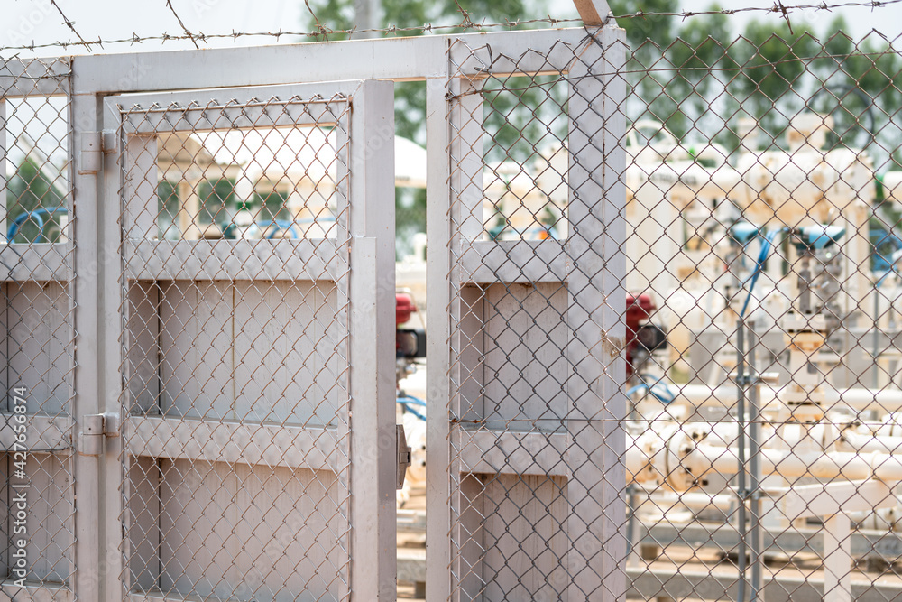 A heavy metal safety gate, way in to tranfer piping working area of ...
