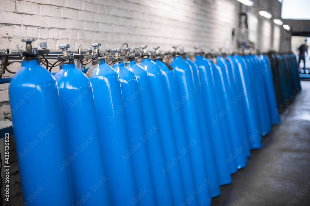 Oxygen cylinder with compressed gas. Blue Oxygen tanks for industry ...