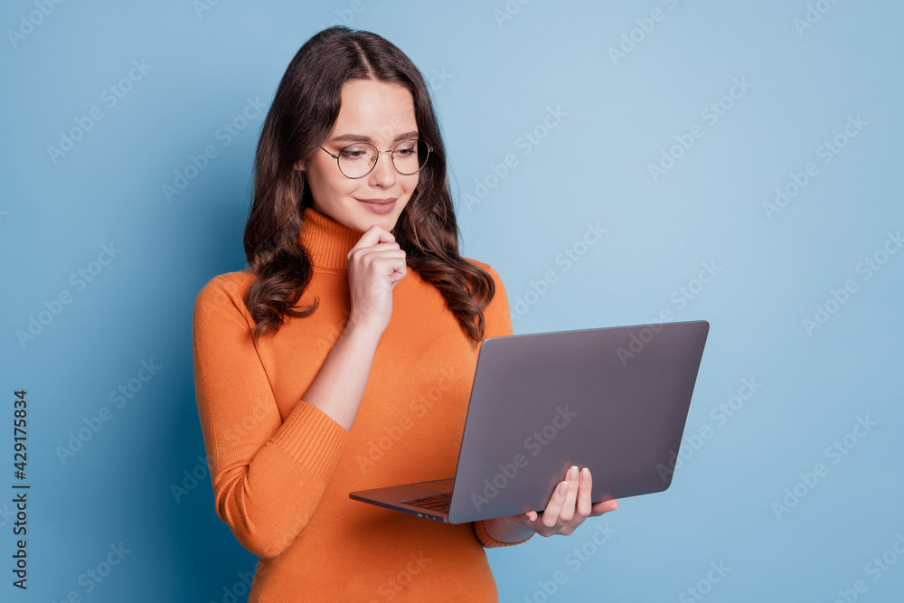Profile photo of intelligent programmer lady hold laptop think finger ...