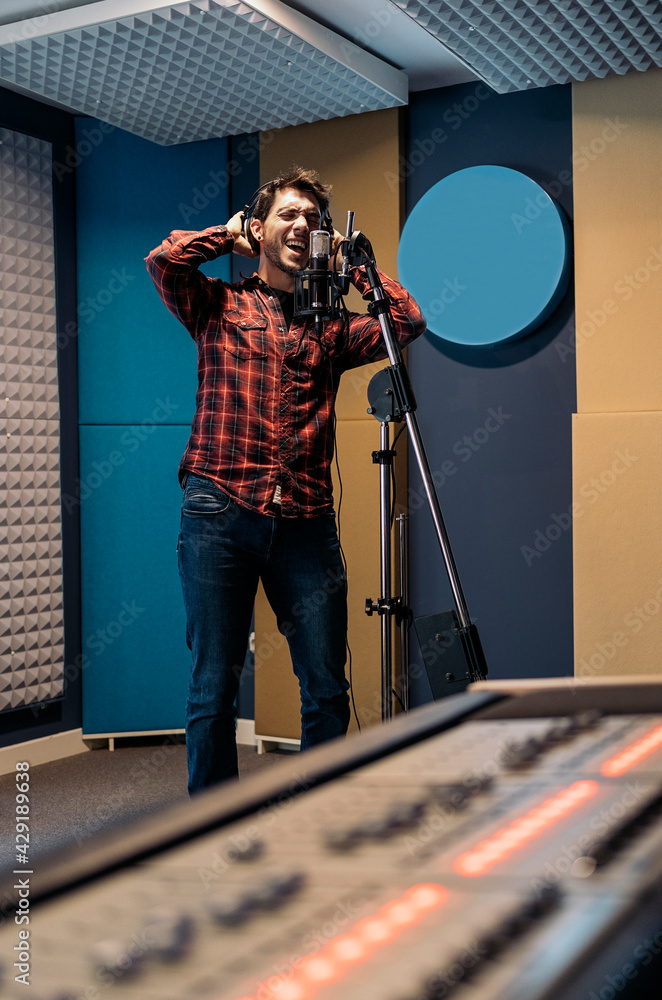 Young Singer Laying Down Tracks In A Recording Studio Stock Photo ...