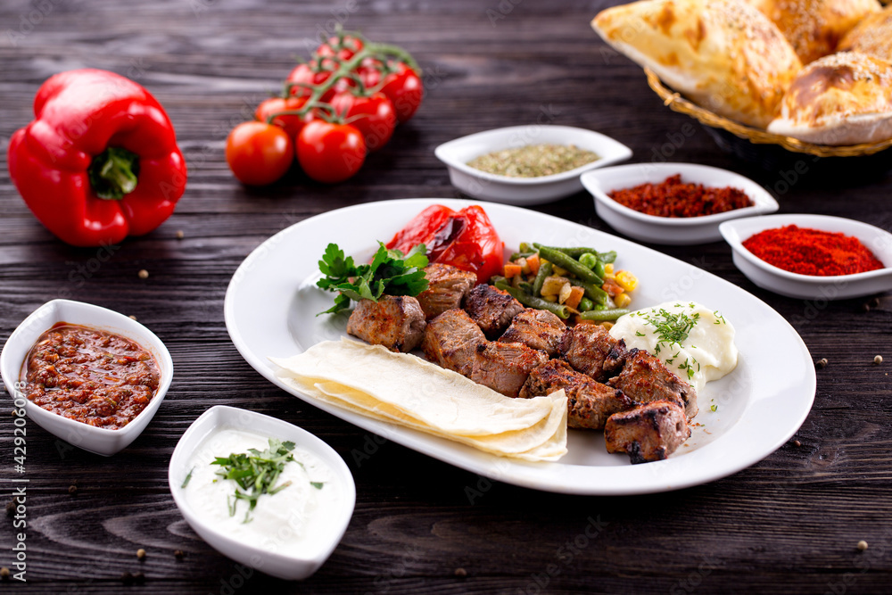 Assorted Middle Eastern and arabic dishes on a dark rustic background ...