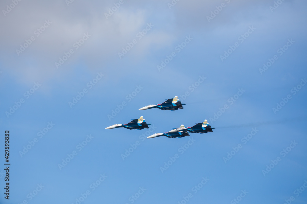 four jet planes are flying in a tight formation. dangerous aerobatics ...
