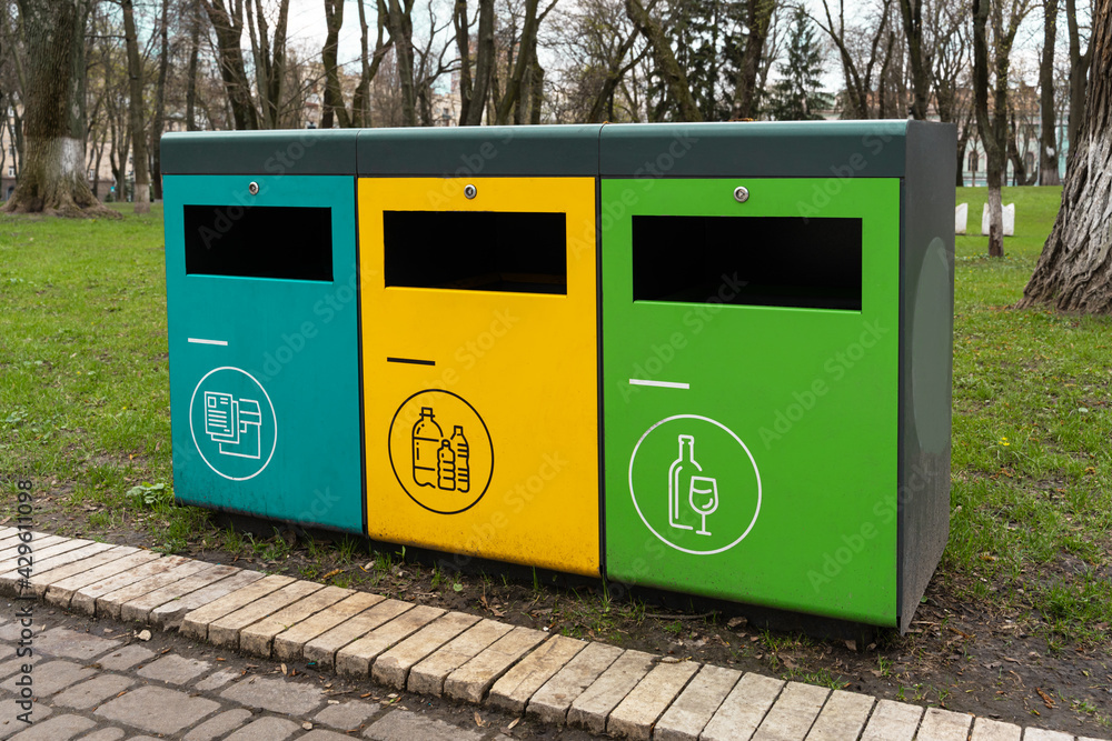waste sorting containers. separate waste bins for glass, plastic and ...
