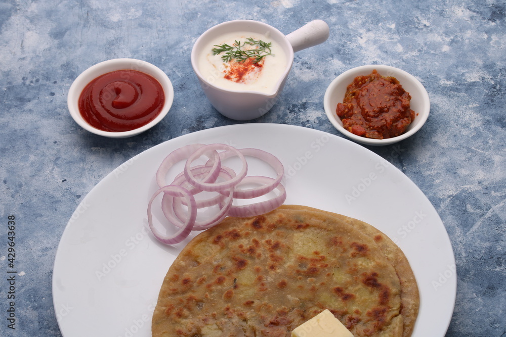 Traditional Indian food Aloo paratha or potato stuffed flat bread ...