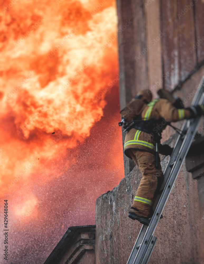 Firefighters put out large massive fire blaze, group of fire men in ...