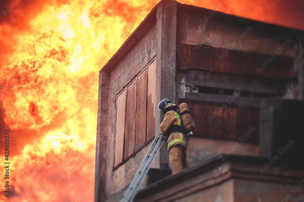 Massive large blaze fire in the city, brick factory building on fire ...