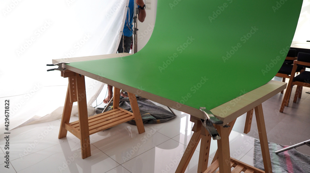 Small set of green screen background in studio. Green screen backdrop ...