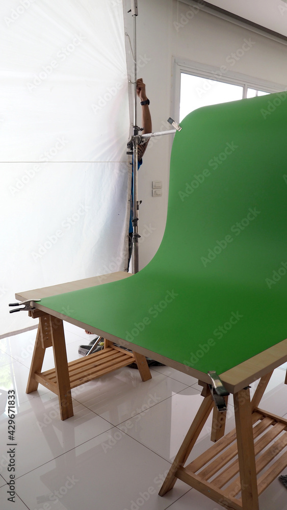 Small set of green screen background in studio. Green screen backdrop ...