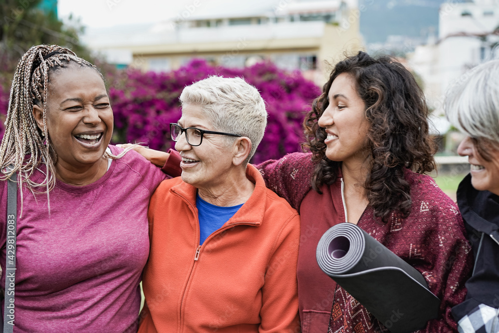 Multi generational women having fun together at city park - Multiracial ...